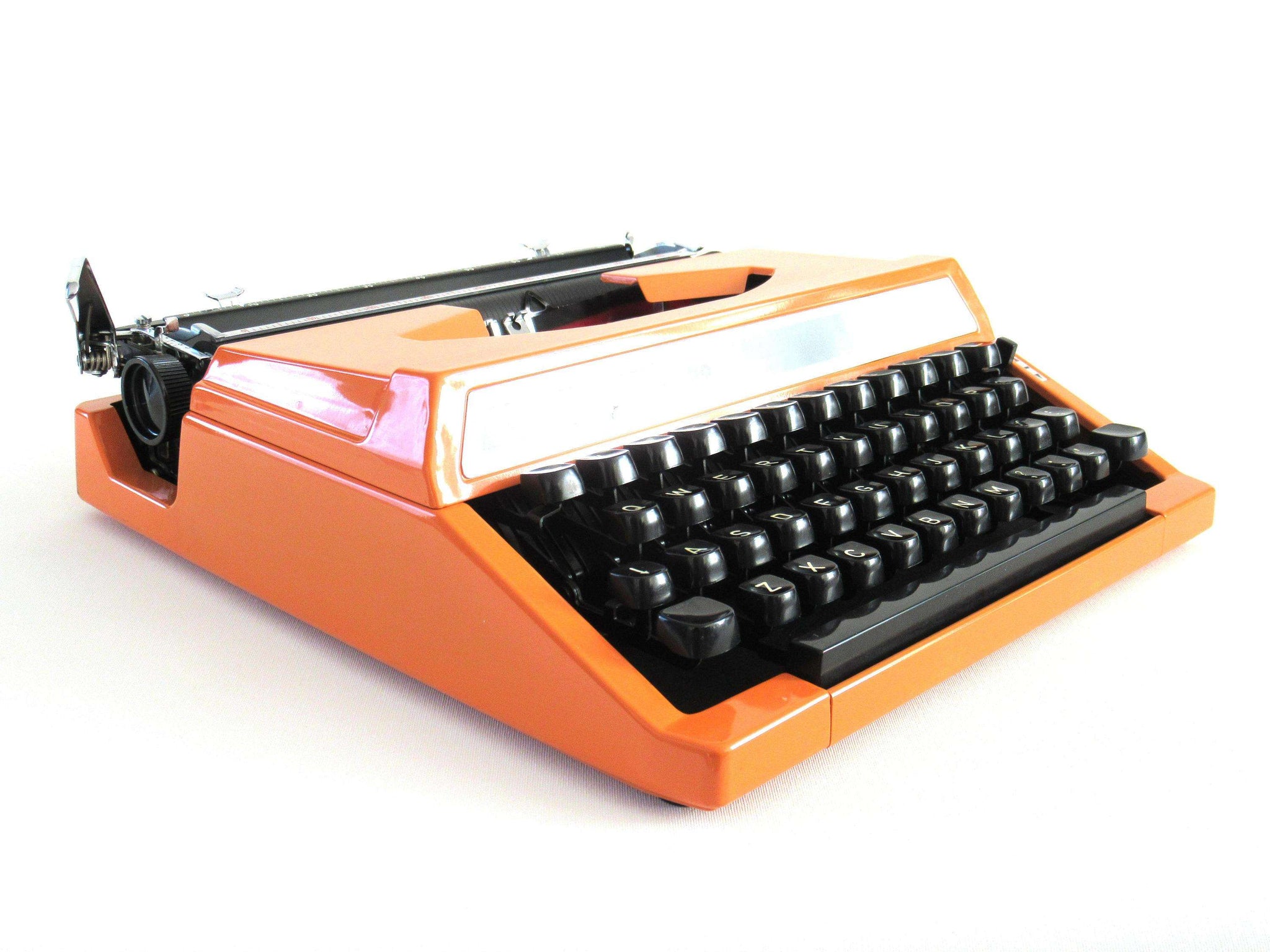 Silver-Reed 100 working typewriter made in 1976. 1970's Orange typewri ...