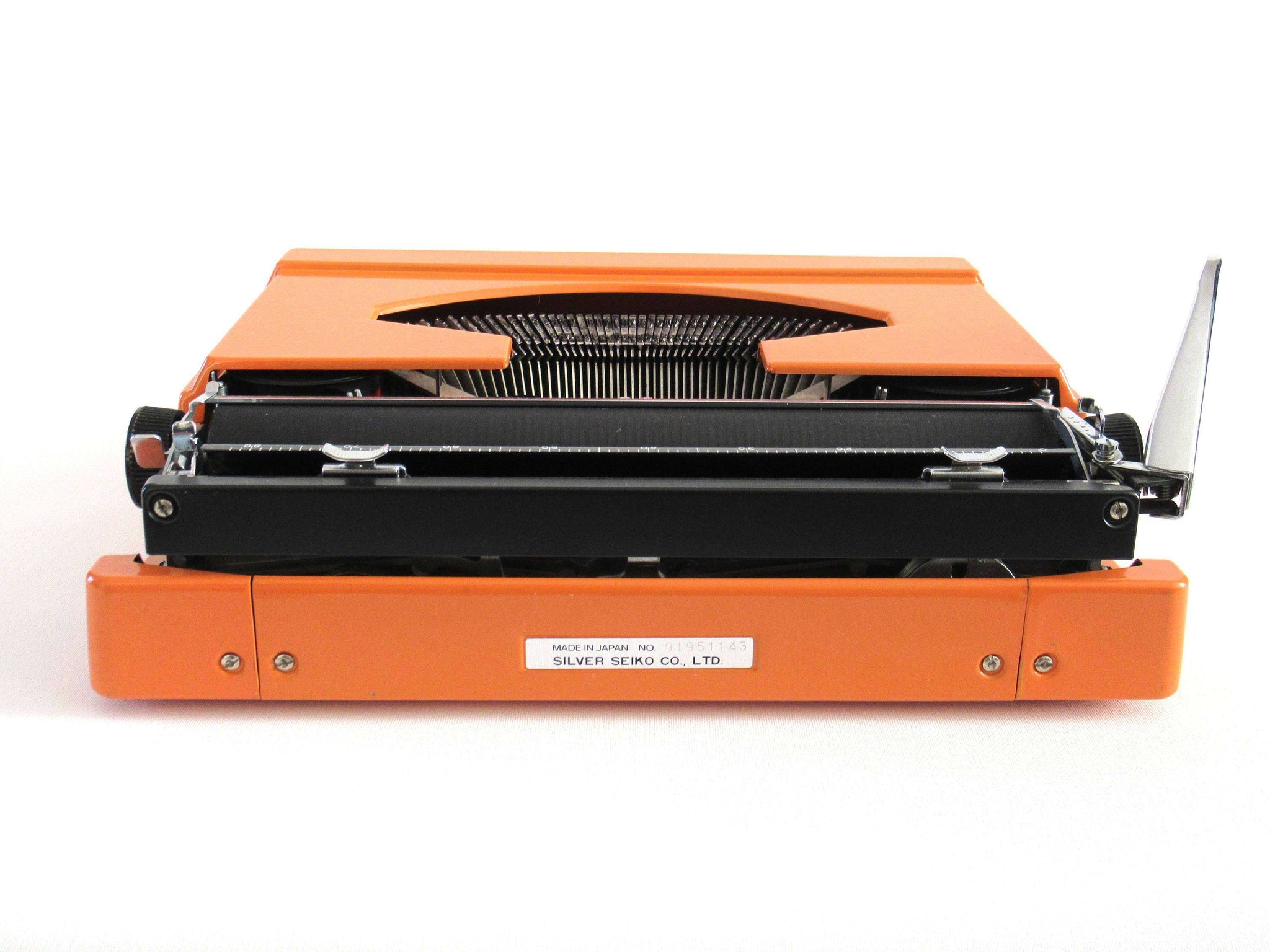 Silver-Reed 100 working typewriter made in 1976. 1970's Orange typewri ...