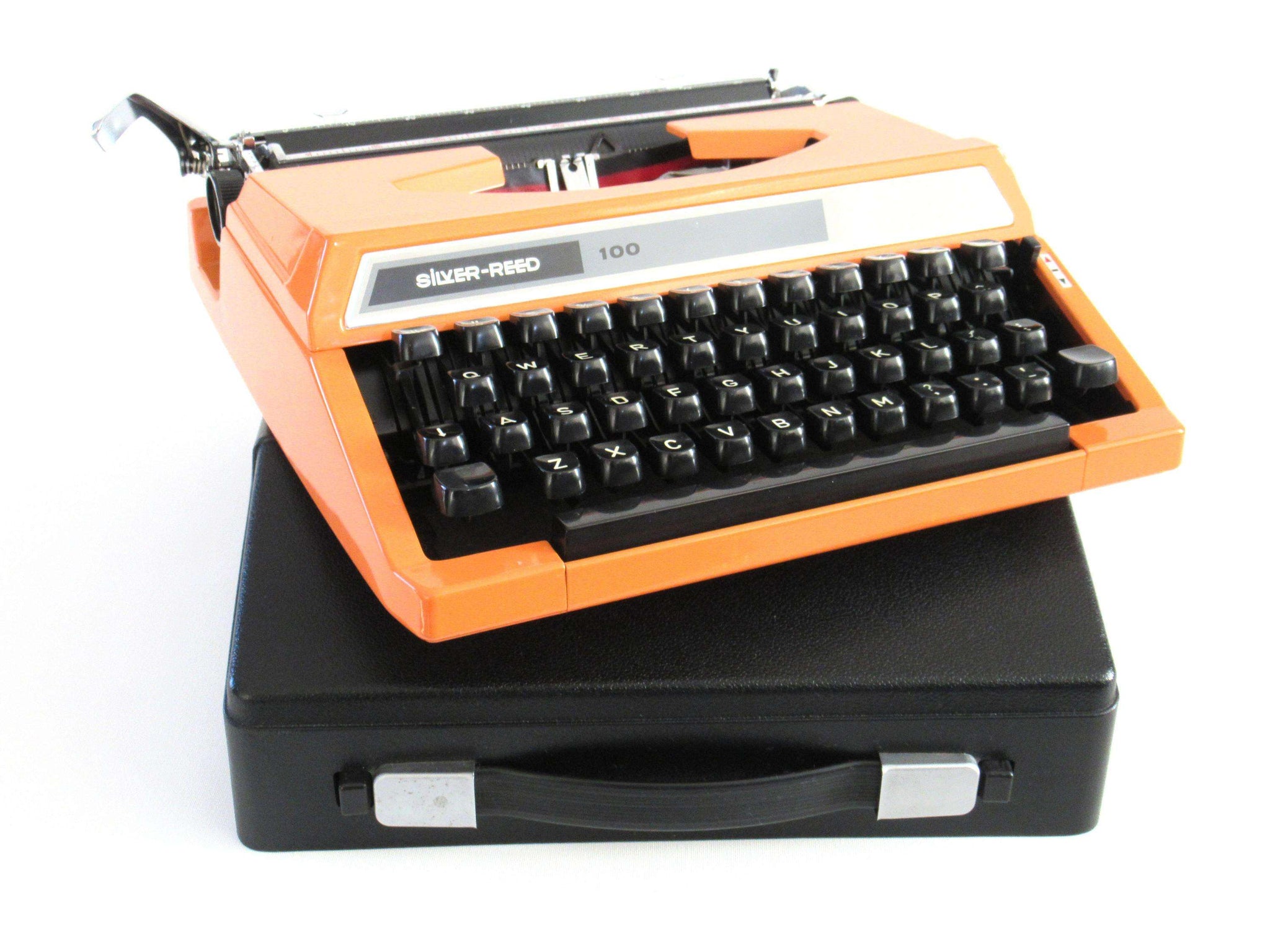 Silver-Reed 100 working typewriter made in 1976. 1970's Orange typewri ...